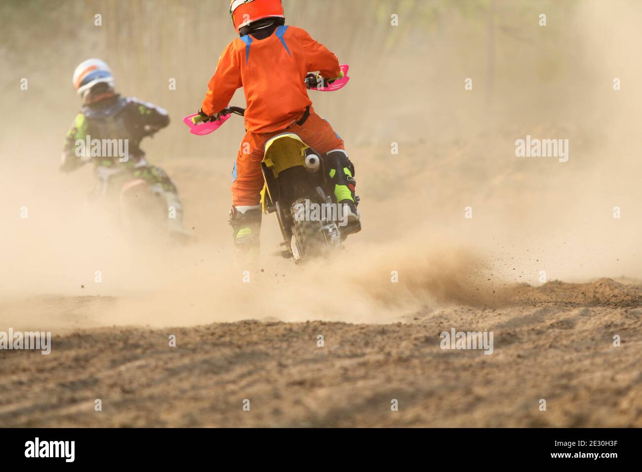 Motocross racer accelerating speed in track Stock Photo - Alamy