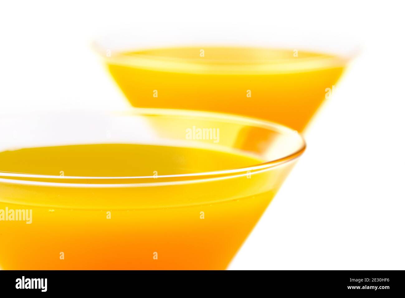 The Yellow Two Cocktail glasses in white background Stock Photo - Alamy