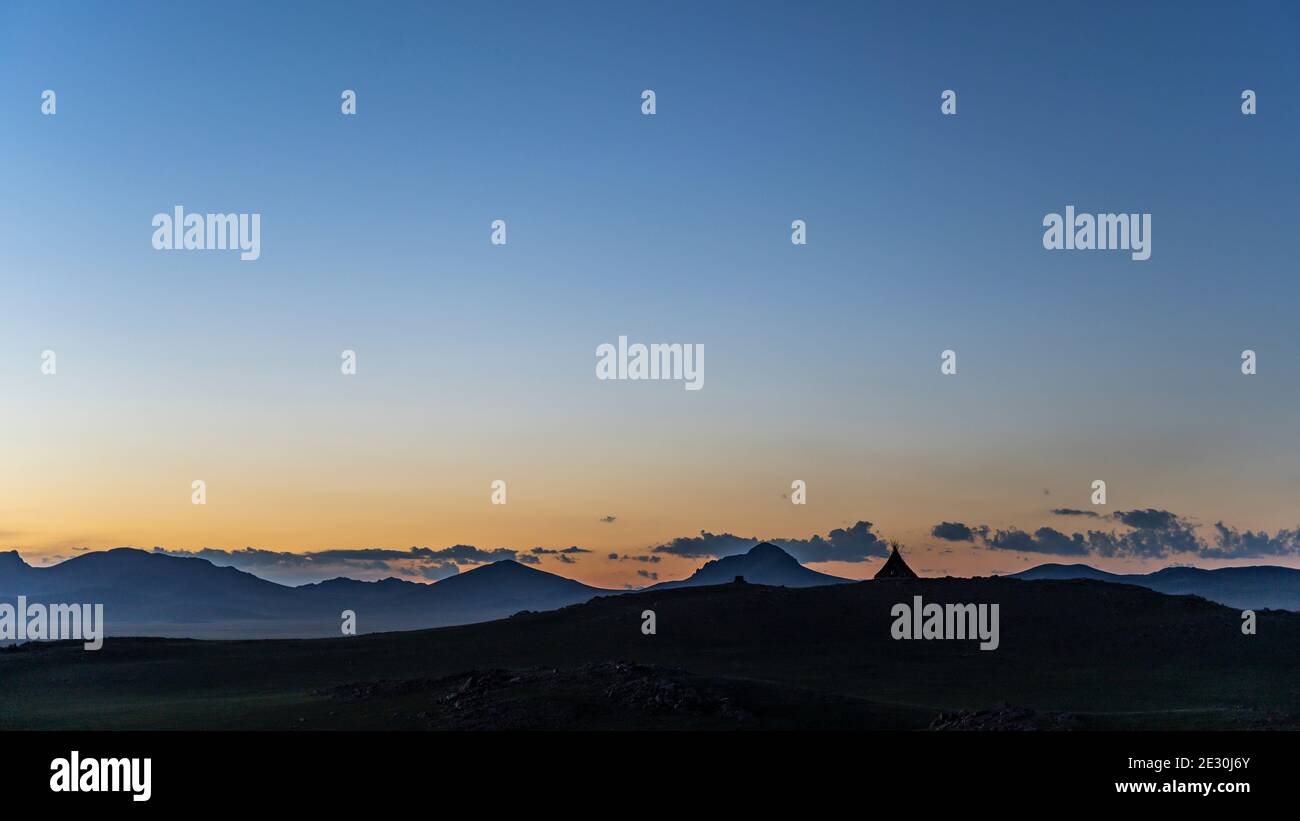 Ovoo on top of a hill at night wit clear sky in the steppe of Mongolia ...