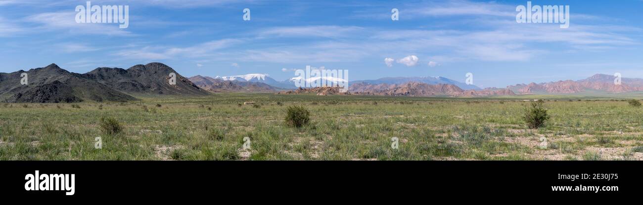 Panorama of Bayan Olgi valley with grass steppe and some houses and ...