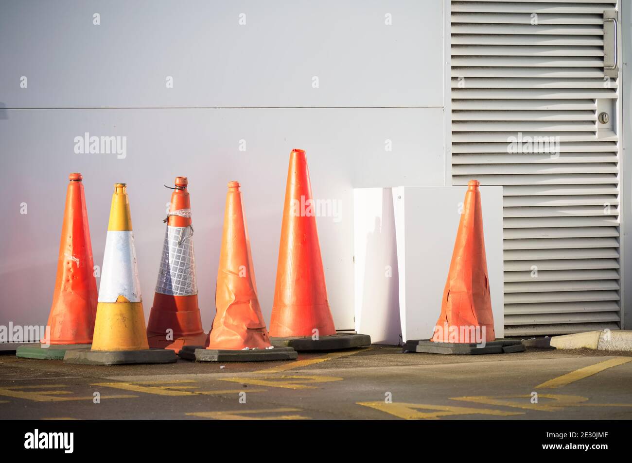 Red traffic cones at construction site plant room Stock Photo - Alamy