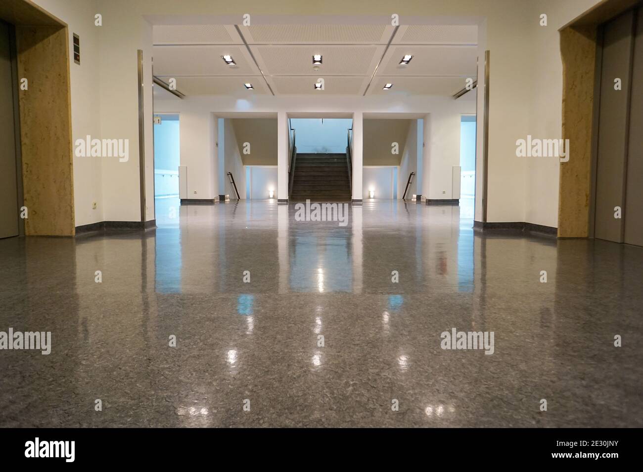 Lobby of a building with elevators and stairs Stock Photo - Alamy