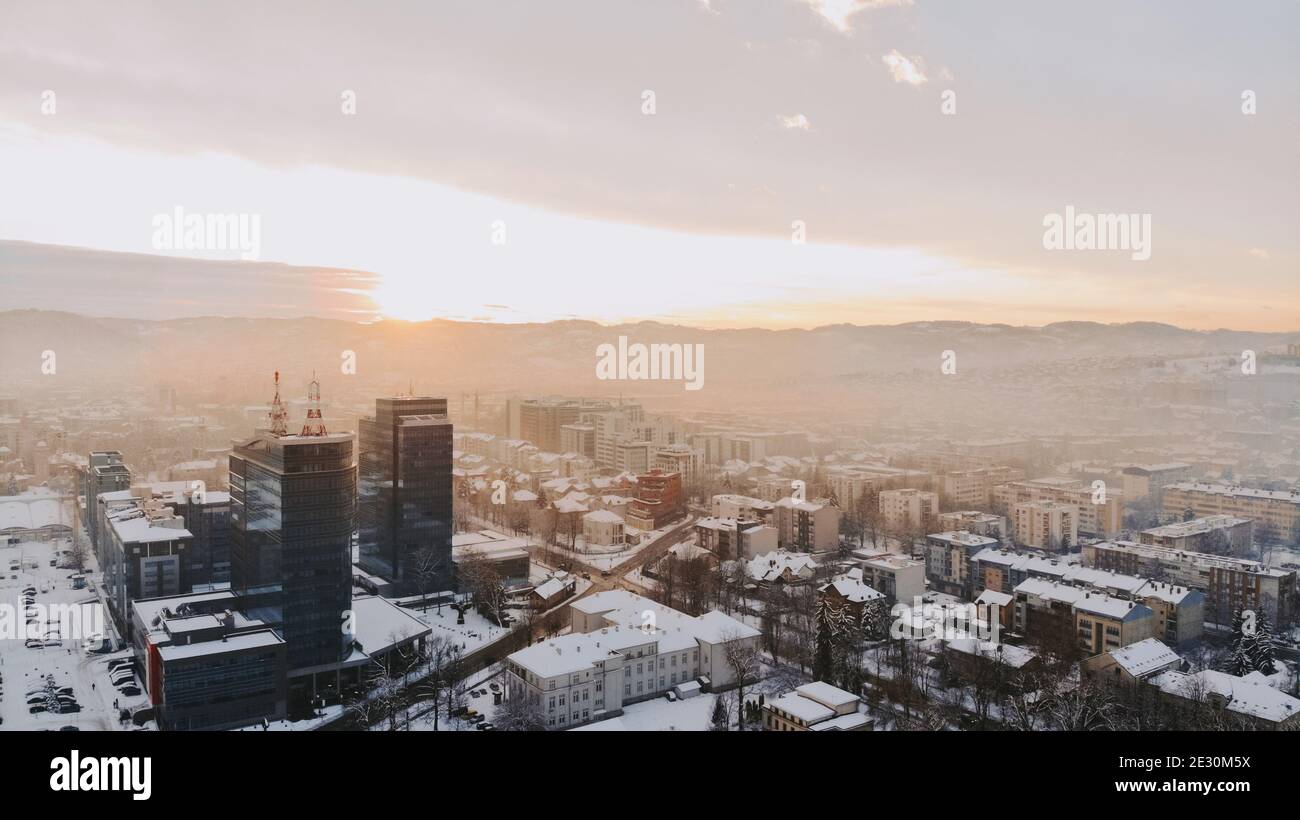 Aerial view of an urban cityscape of snow-covered traditional housing ...