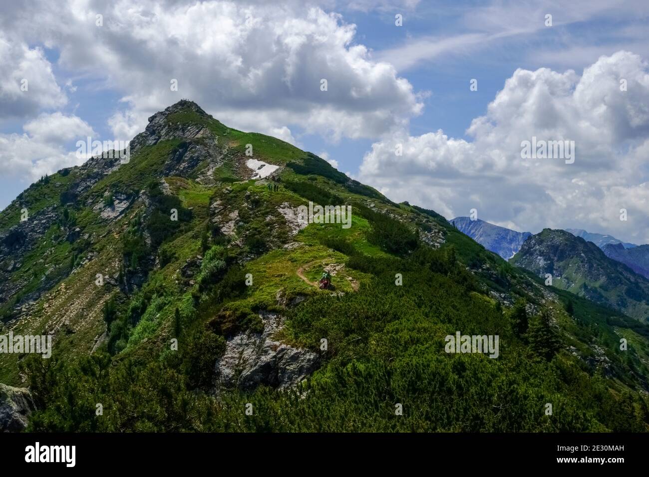 mountain with a small path to the summit with clouds on the sky Stock ...