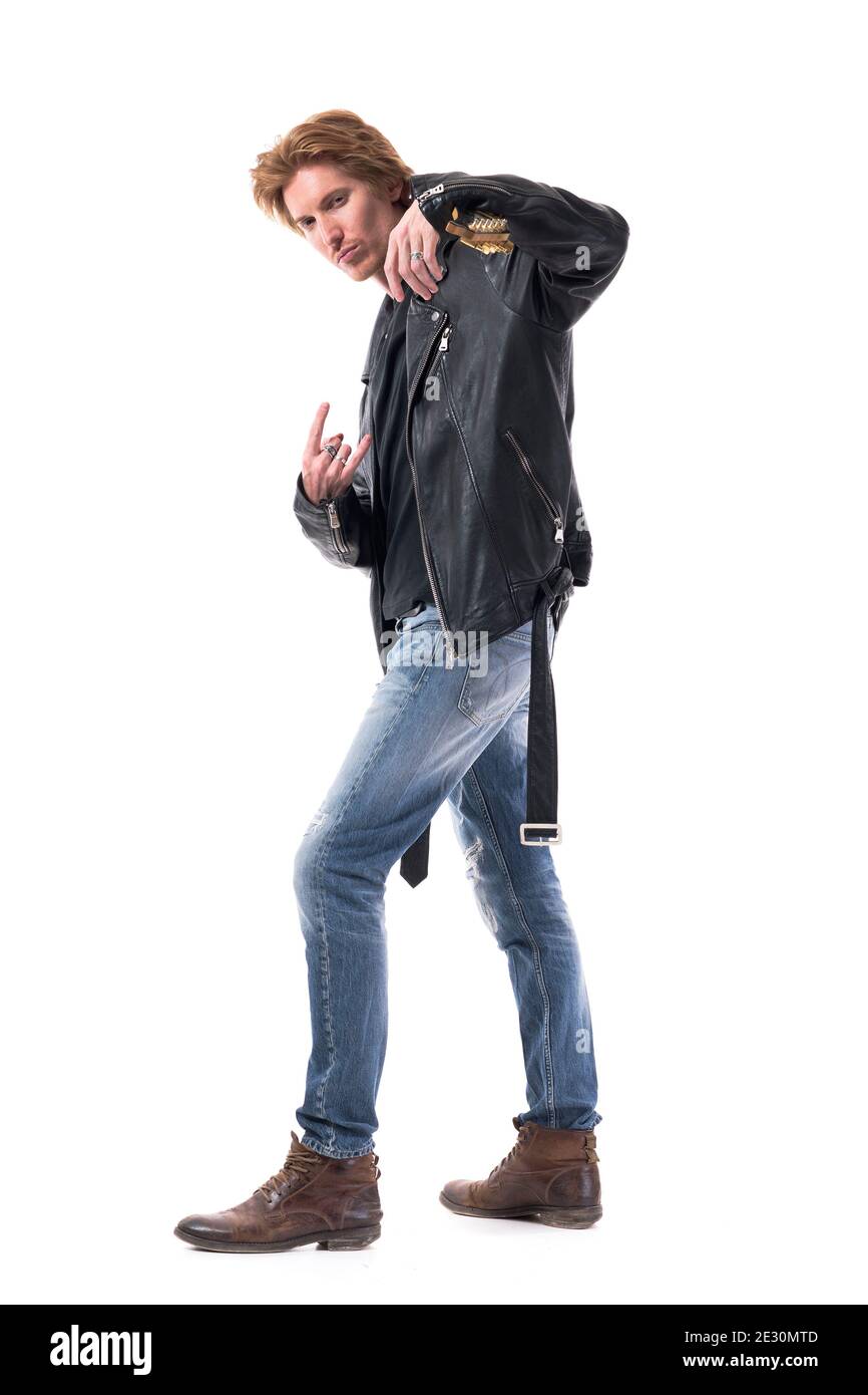 Young stylish handsome rocker with electric guitar in leather jacket ...