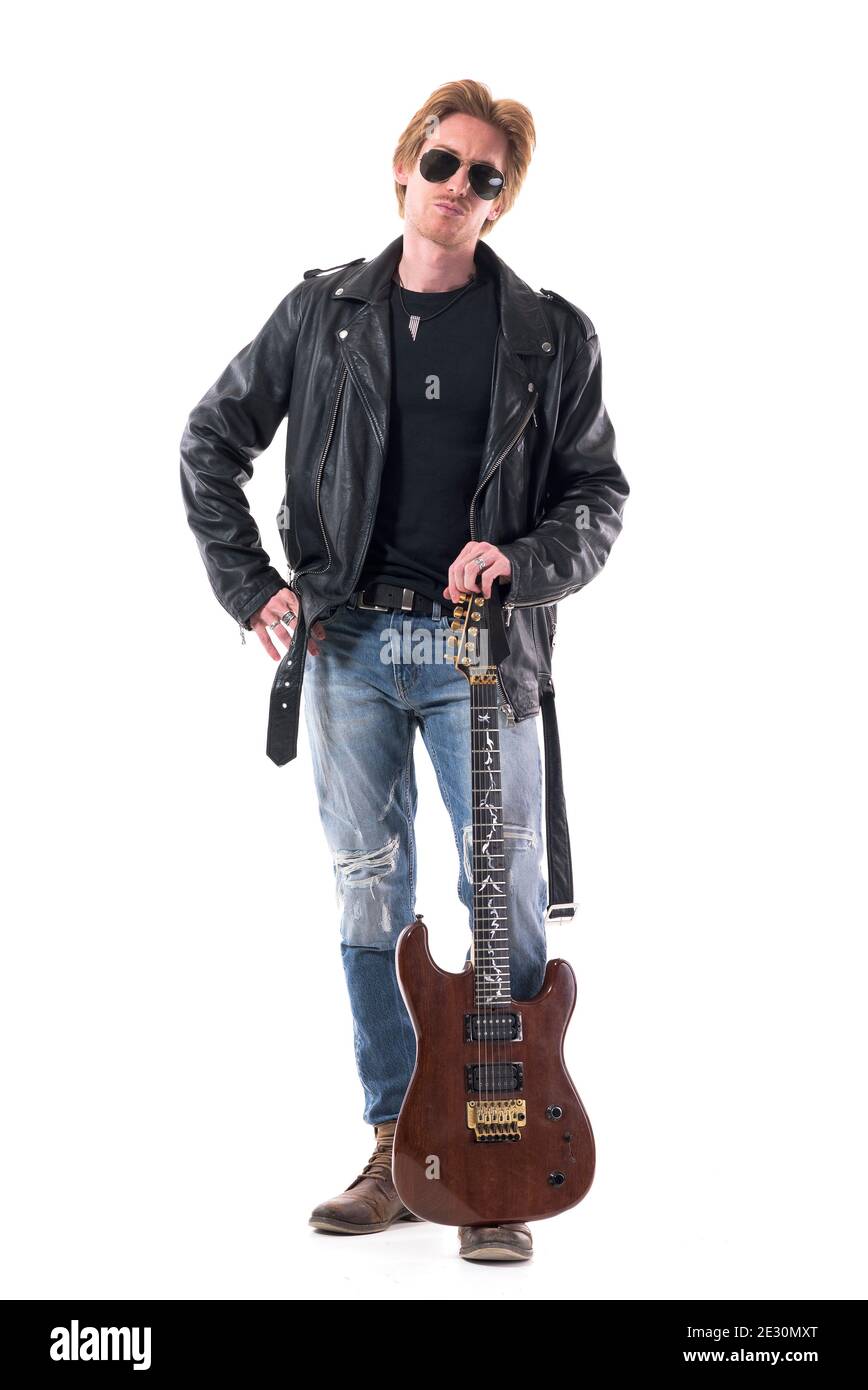 Confident young handsome redhead rock musician posing and holding ...
