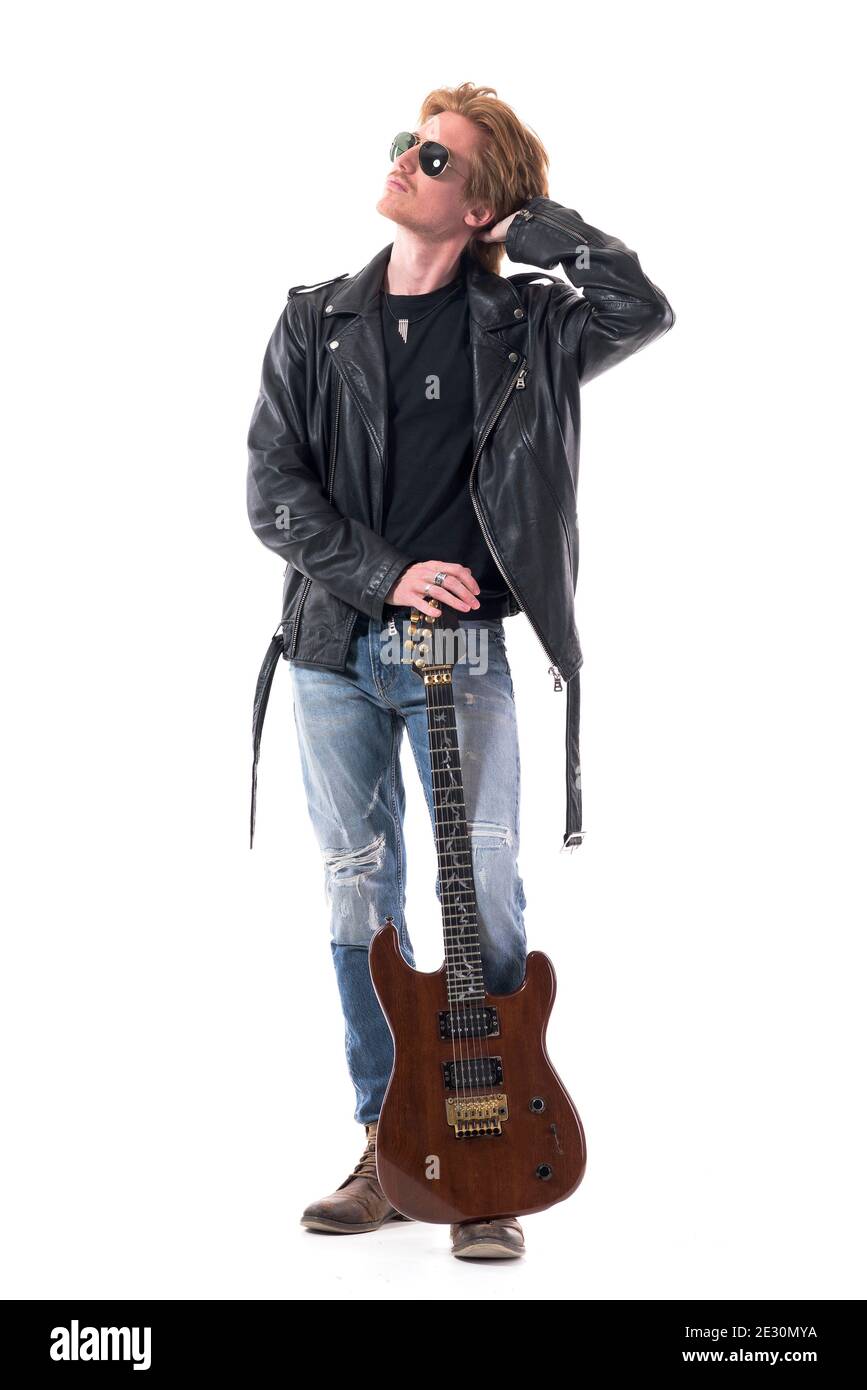 Handsome stylish rocker man looking up for music inspiration with hand ...