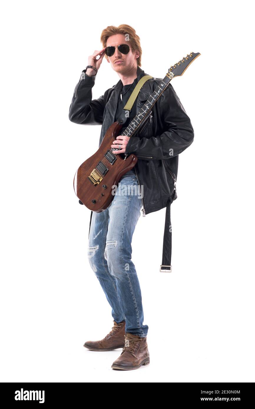 Fashionable redhead handsome rock music guitarist posing holding ...