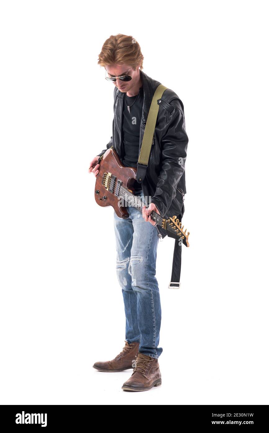 Side view of redhead rock music guitarist getting ready prepare for ...