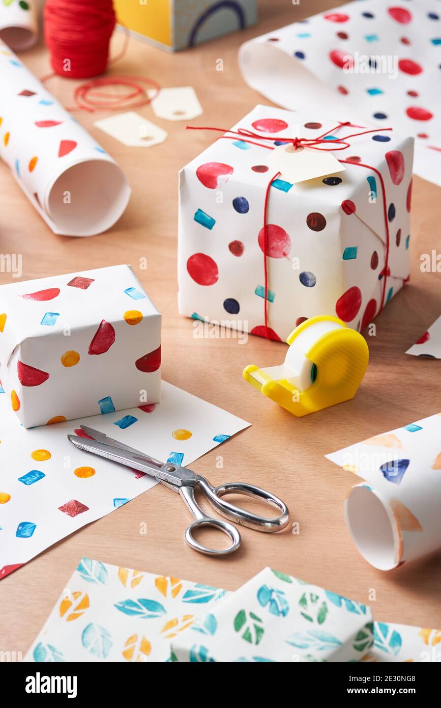 Wrapped gift and scissors hi-res stock photography and images - Alamy