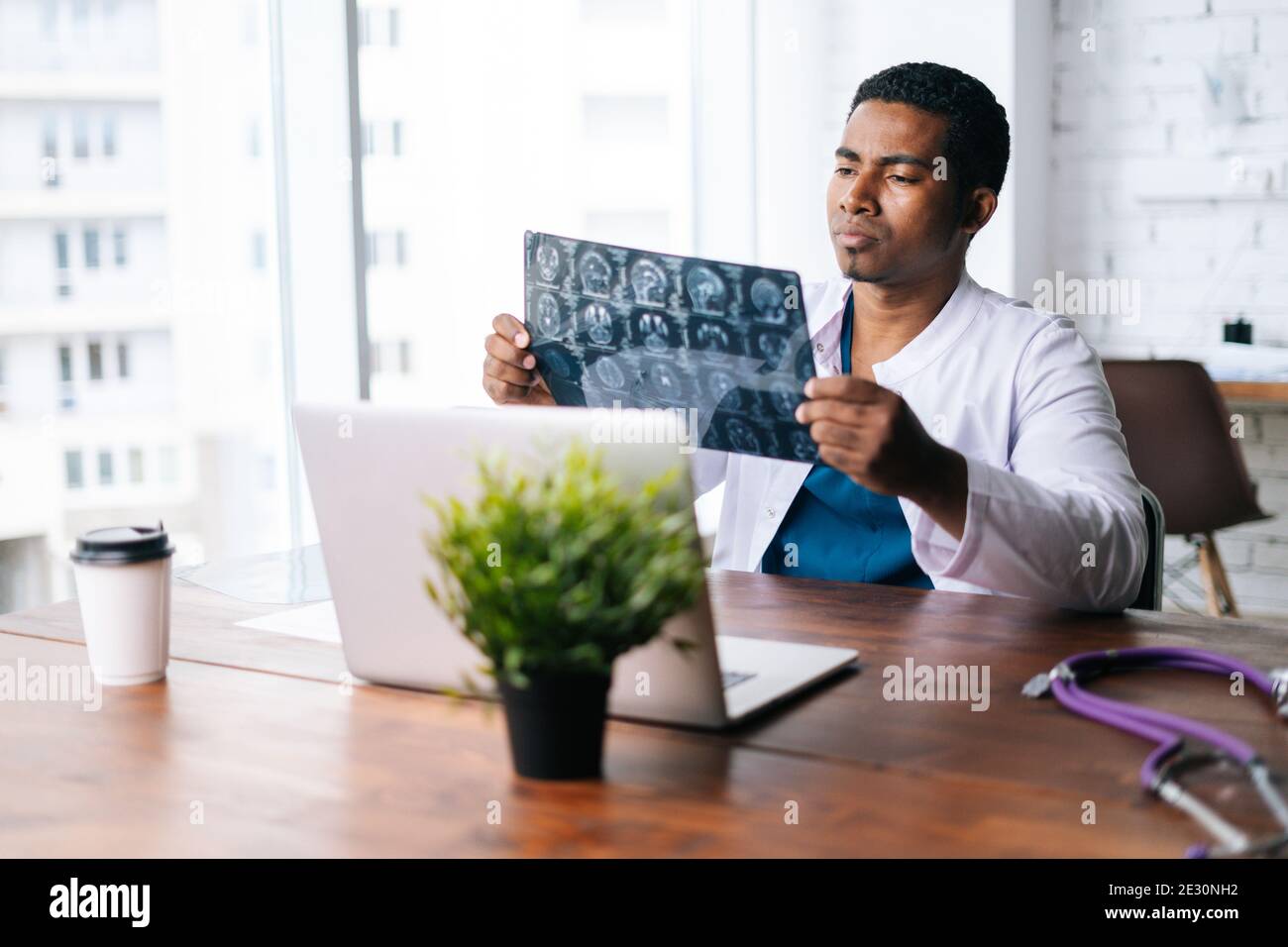 Side view of African American man doctor wearing surgeon medic suit ...