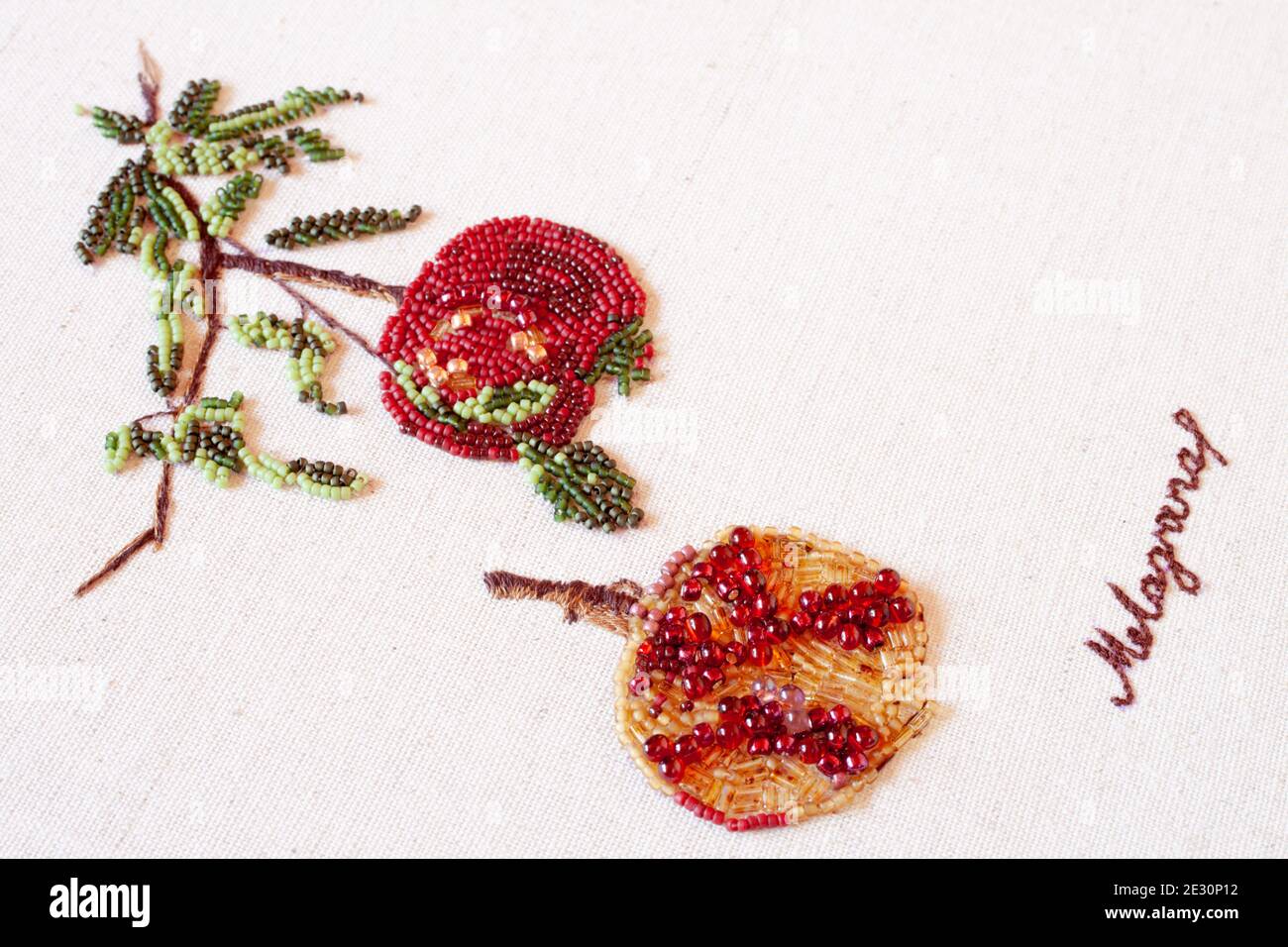 Couture embroidery of pomegranate. Still life with fruits Stock Photo ...