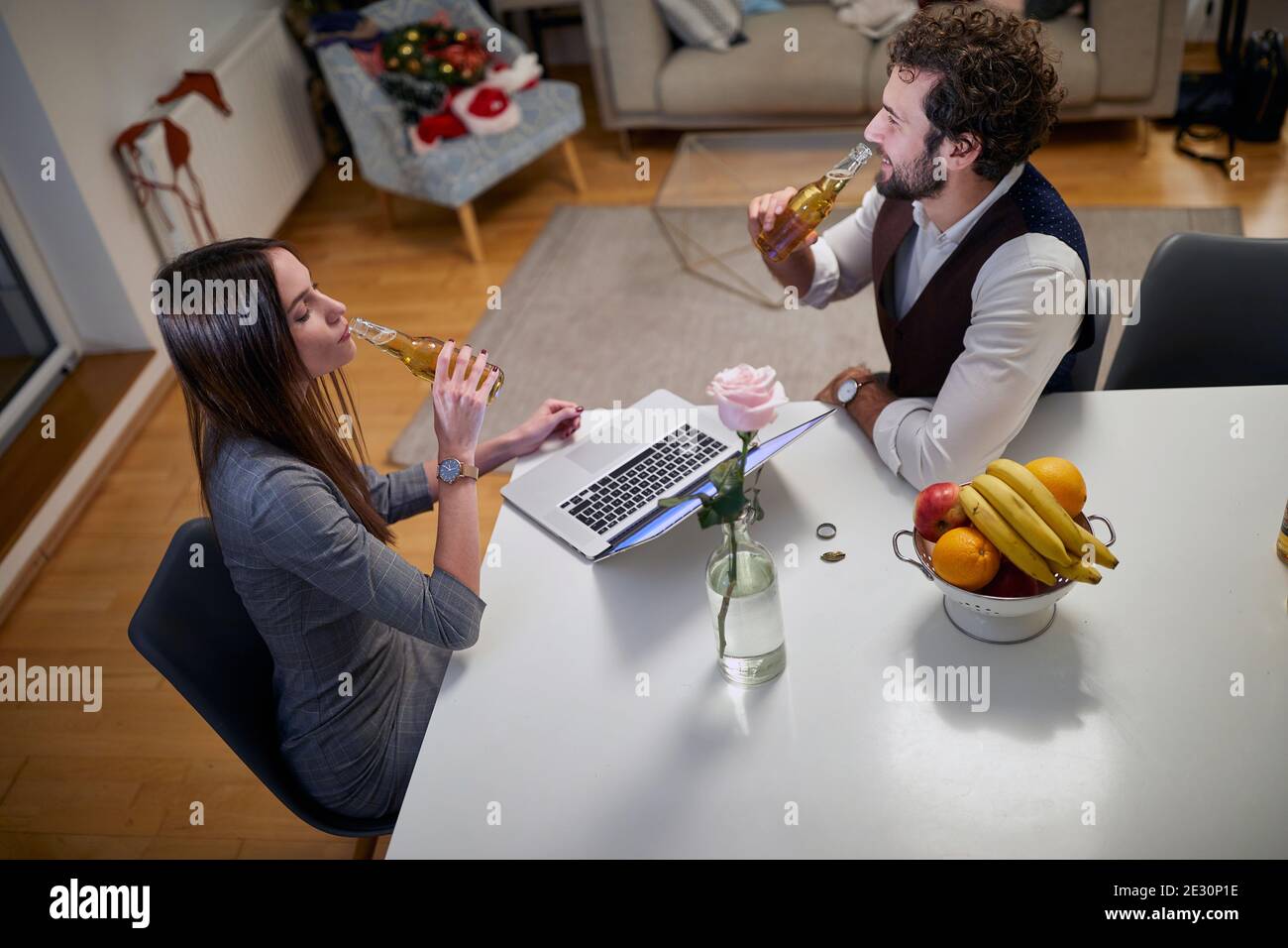 Two work colleagues casually hanging out and drinking Stock Photo - Alamy