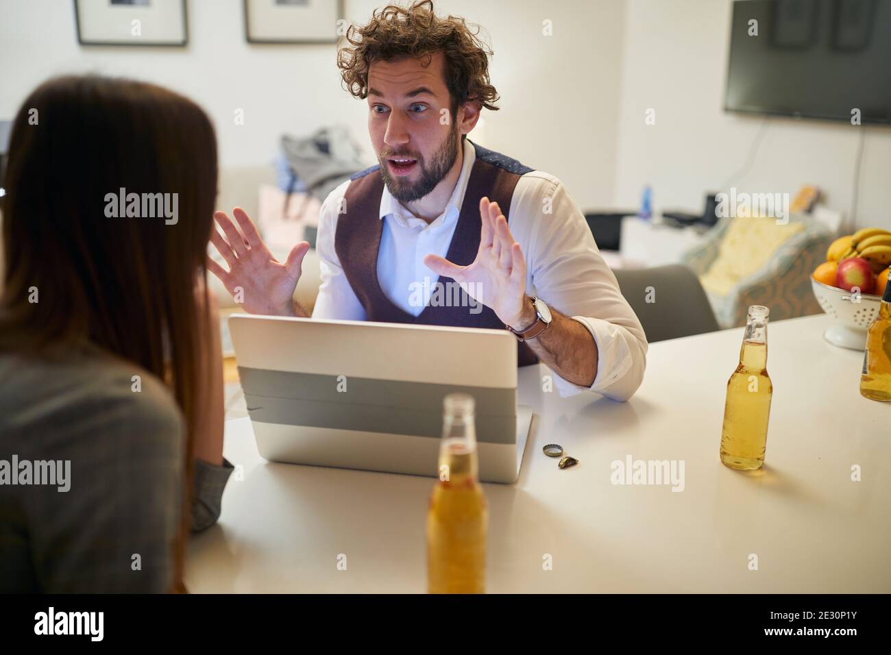 Two business colleagues casually hanging out and drinking Stock Photo ...