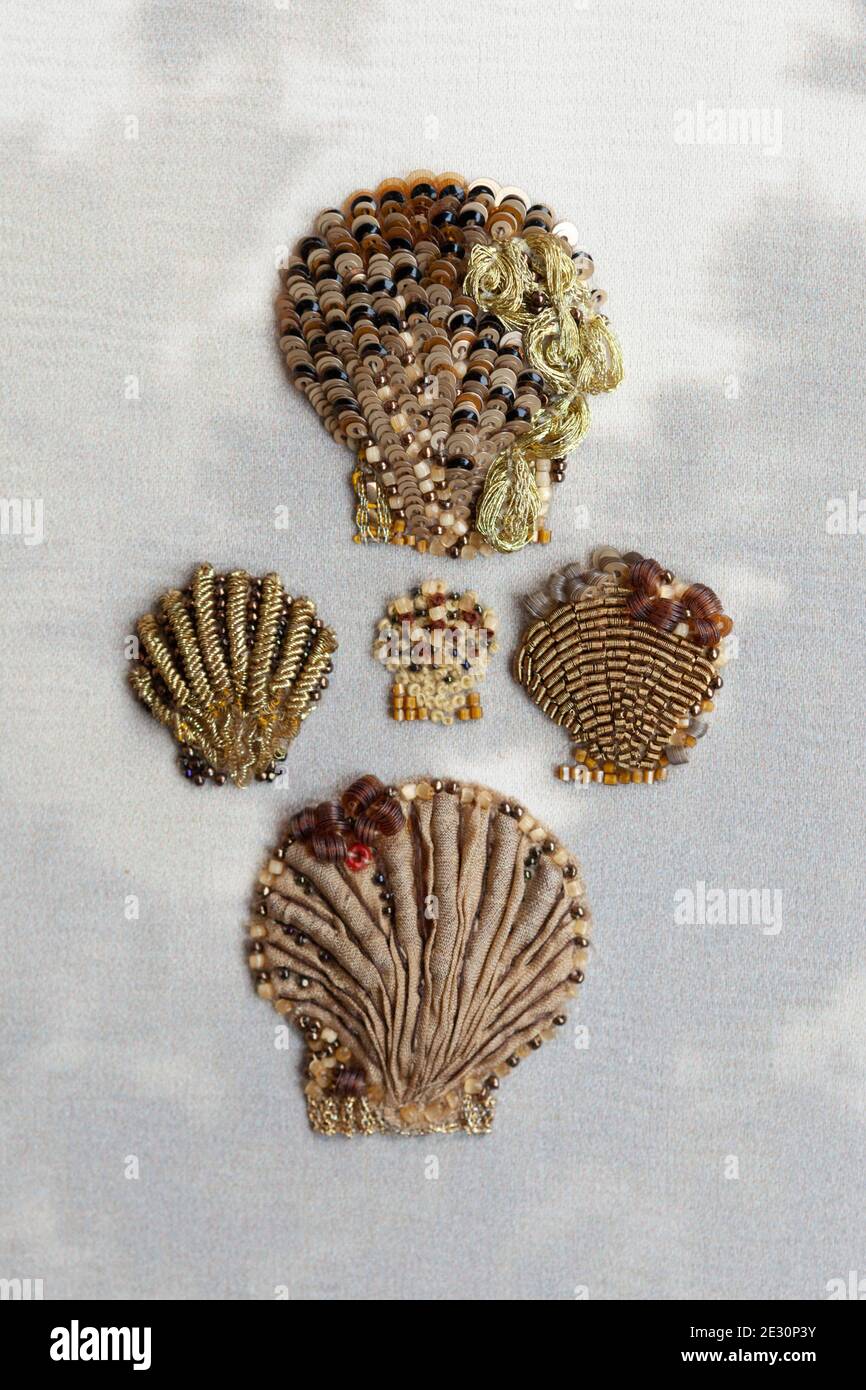 Couture embroidery of sea shells Stock Photo - Alamy