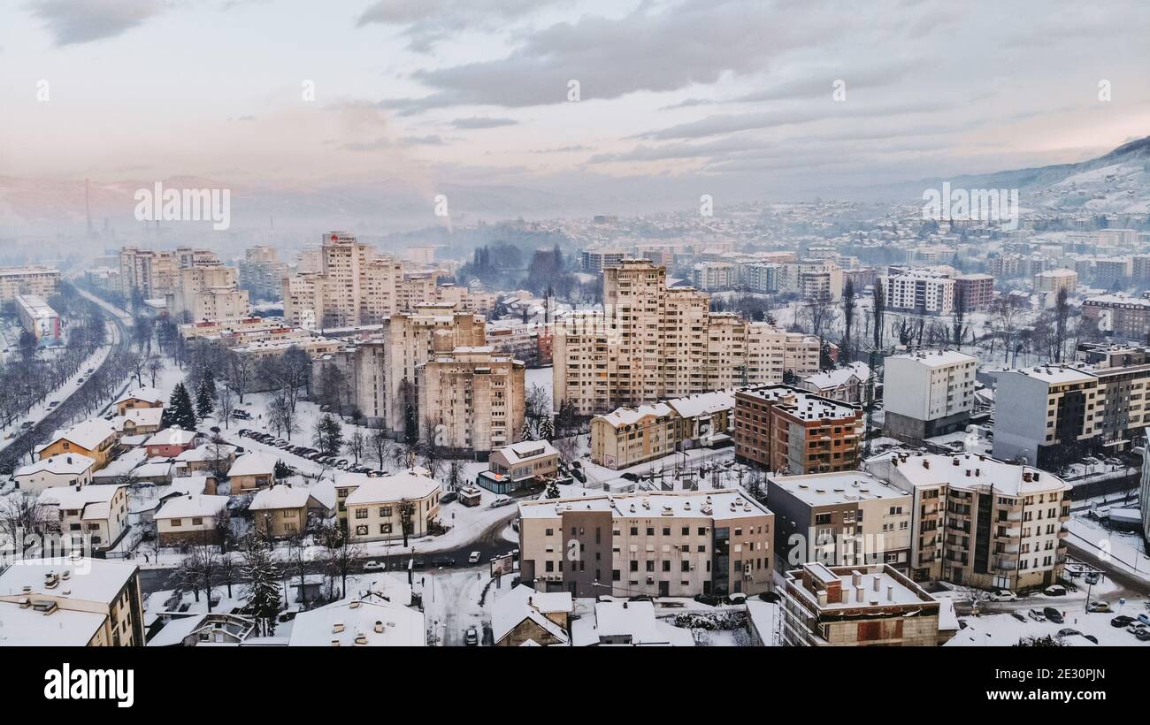 Aerial view of an urban cityscape of snow-covered typical residential ...