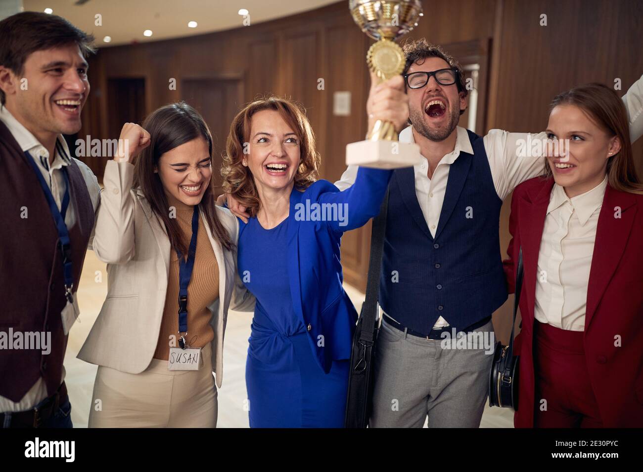 Hotel staff standing together smiling hi-res stock photography and ...