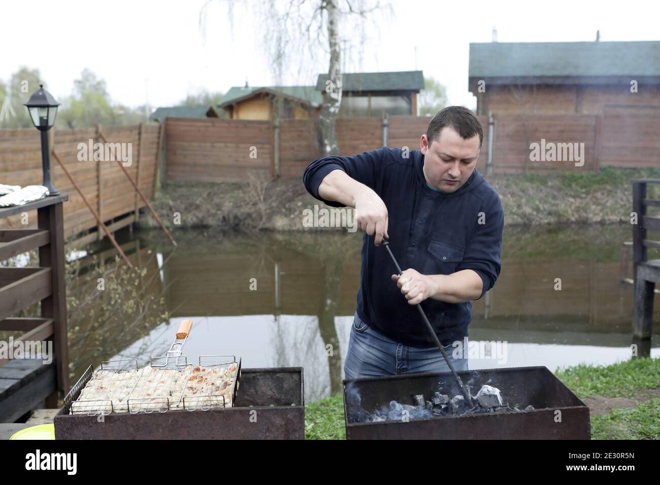 Chicken male adult barbecue cooking hi-res stock photography and images ...