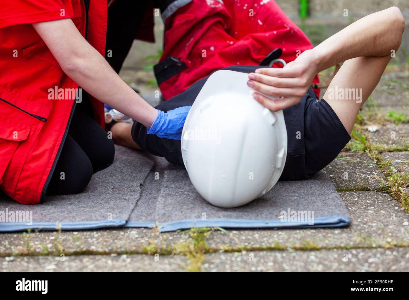 First aid after accident on work at construction site Stock Photo - Alamy
