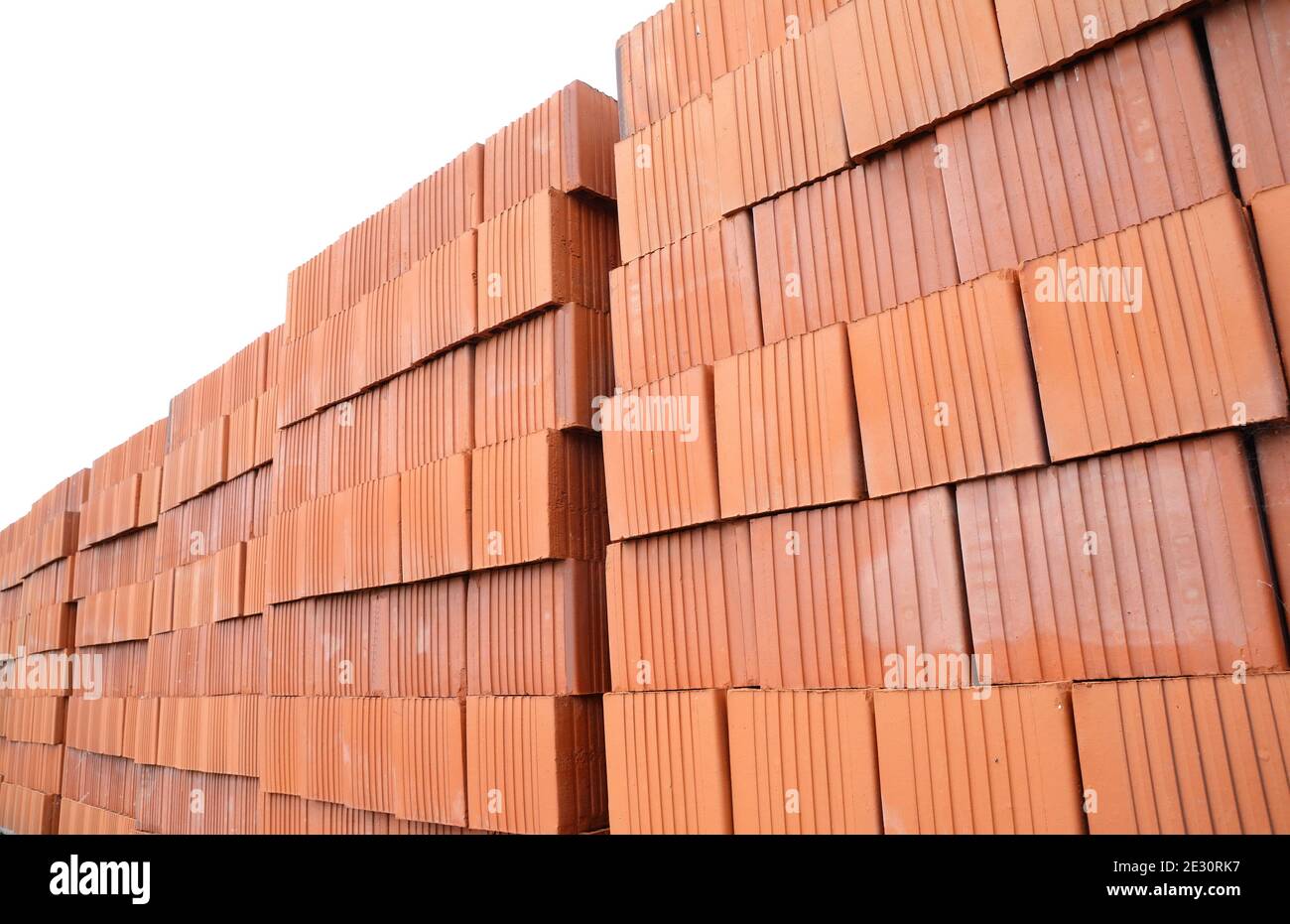 Wall blocks made from red porous ceramics with rectangular holes on a ...