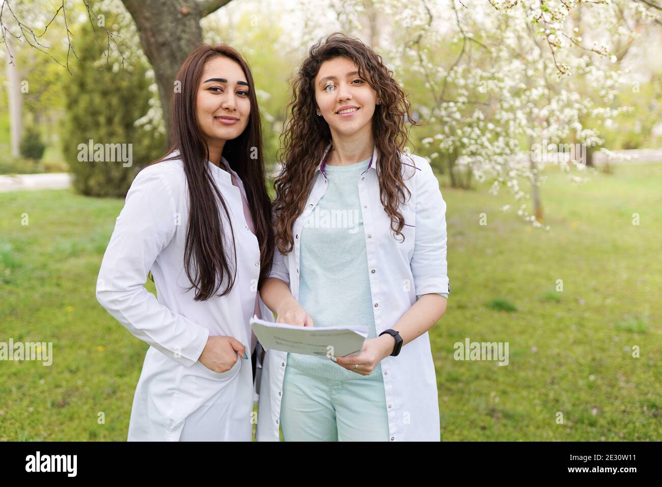 female doctors student outdoors . medical background . students near ...