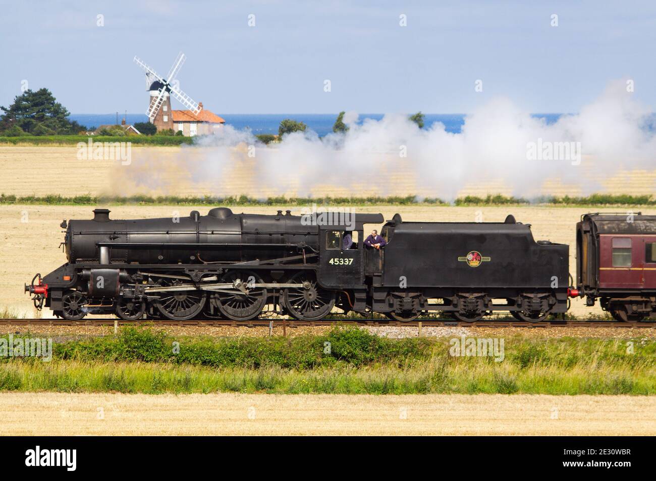 Black Five 45337 steam engine passing Weybourne windmill, North Norfolk ...