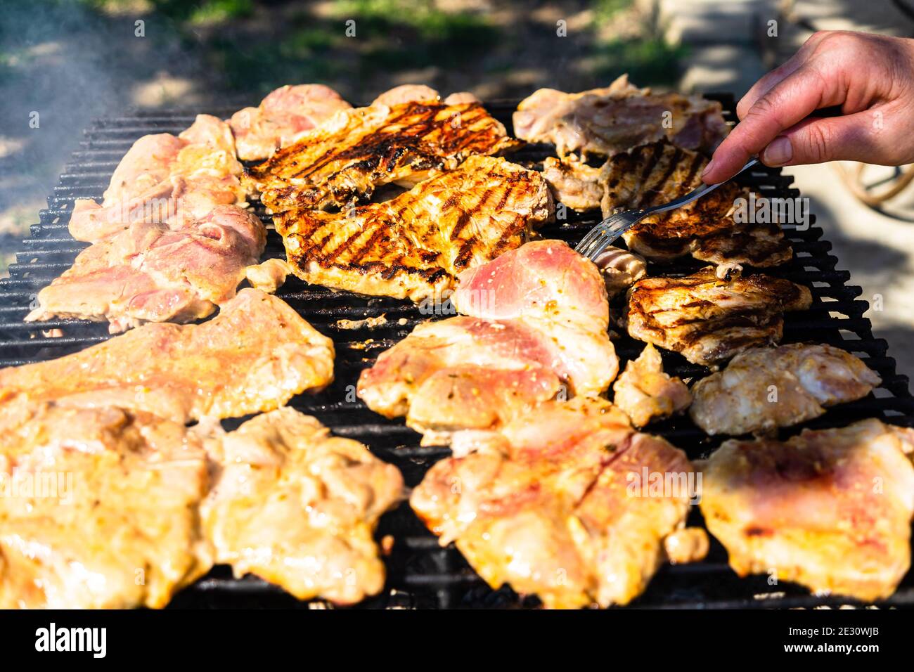 Raw steak on a charcoal barbeque. Top view of camping tasty barbecue ...
