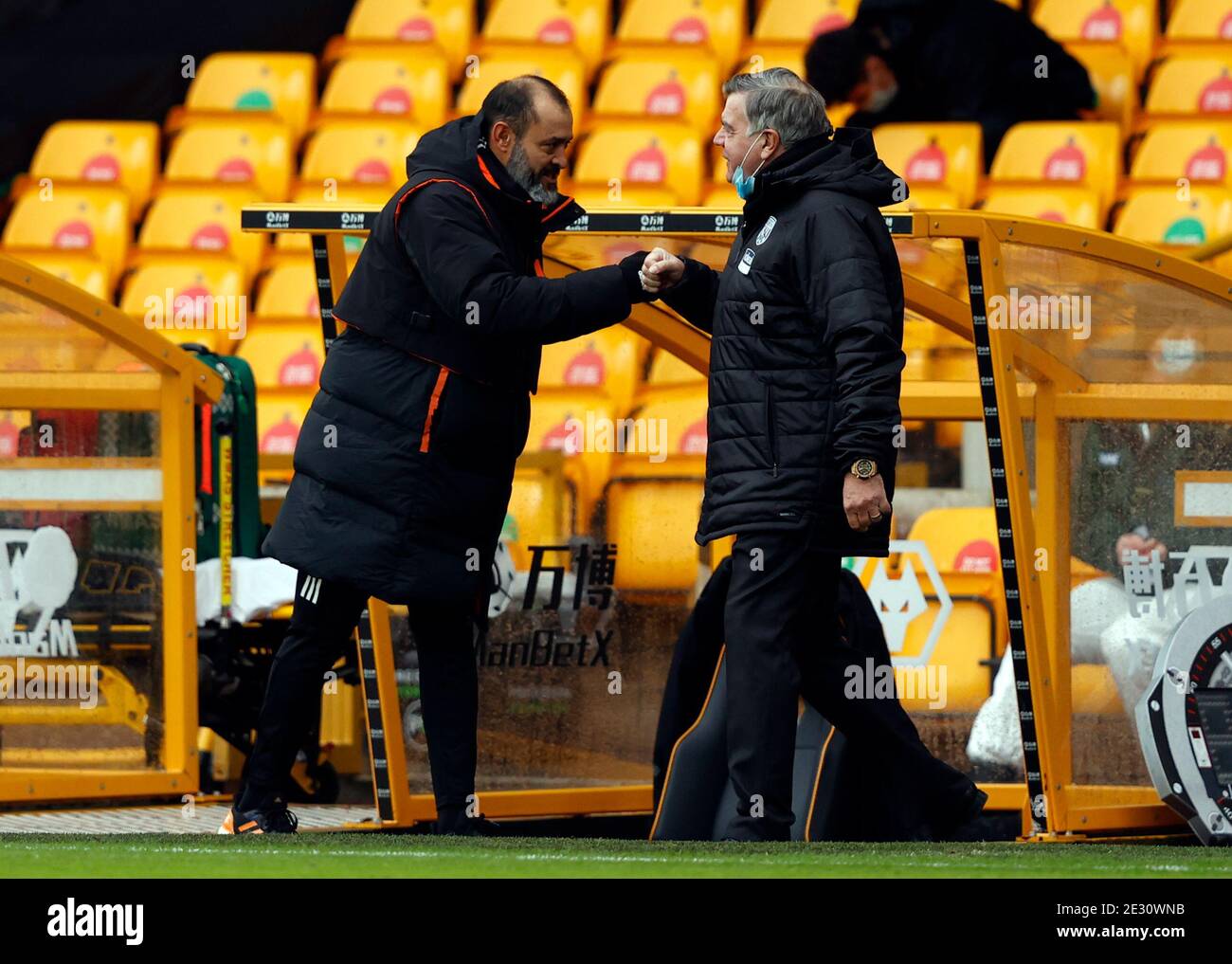 Wolverhampton Wanderers manager Nuno Espirito Santo (left) fist bumps ...