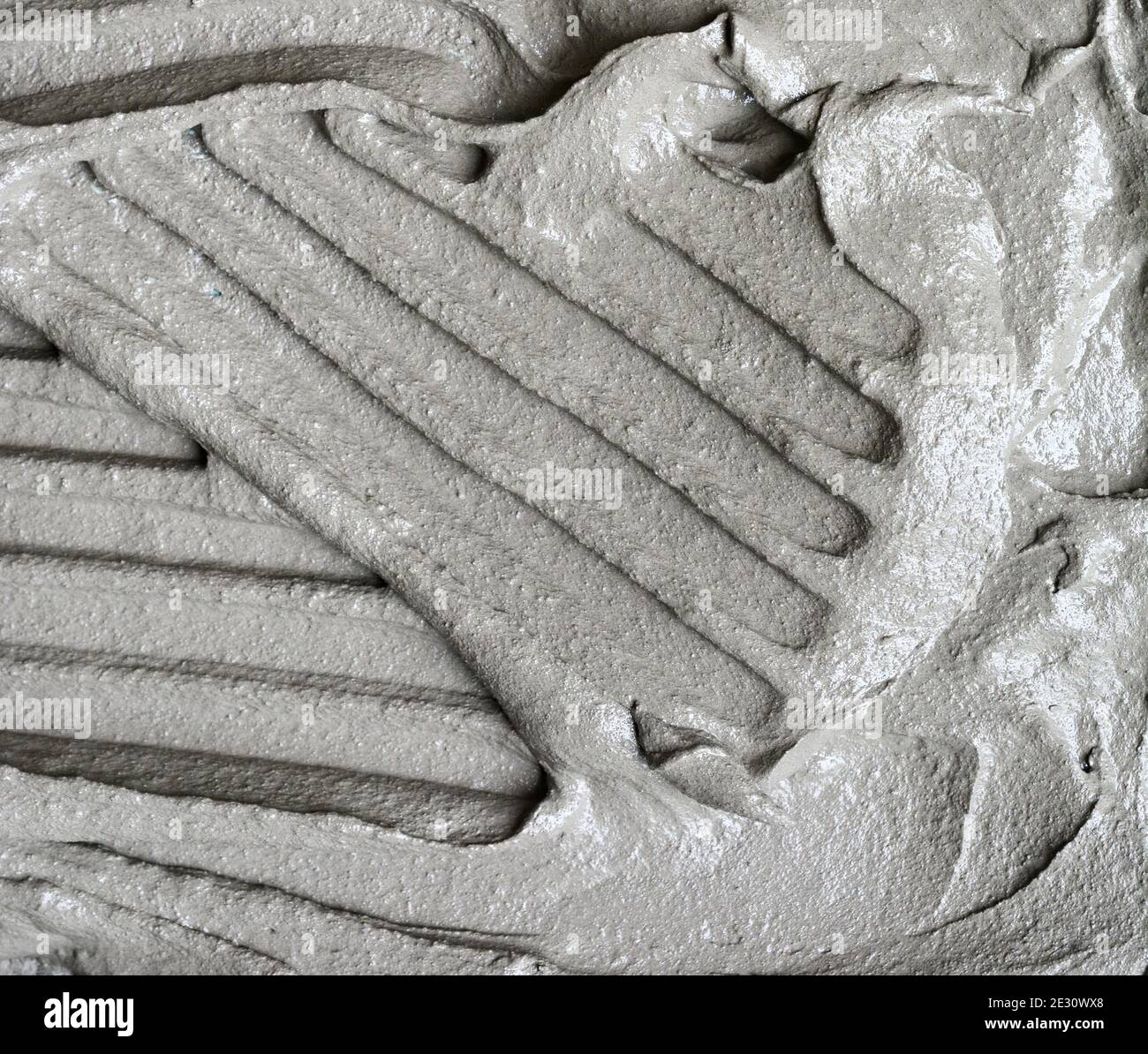 Fresh concrete tehture. Wet mortar surface. Lined grey concrete as ...