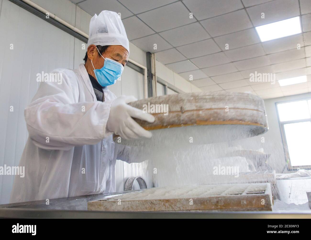 Nantong, China's Jiangsu Province. 16th Jan, 2021. A worker makes rice ...