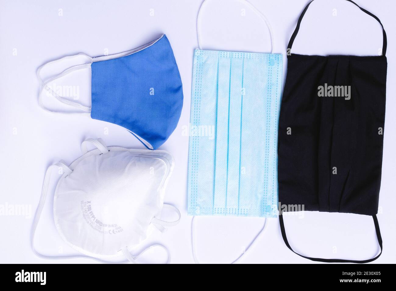 Four different protective masks against infection and spread of the ...