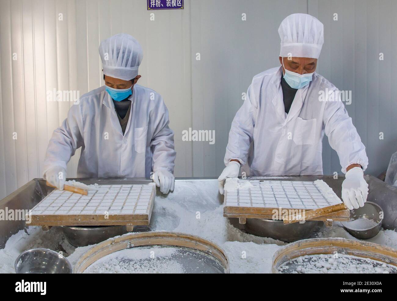 Nantong, China's Jiangsu Province. 16th Jan, 2021. Workers make rice ...