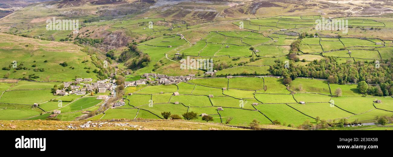 Panoramic view of the village and hay meadows of Gunnerside in spring ...