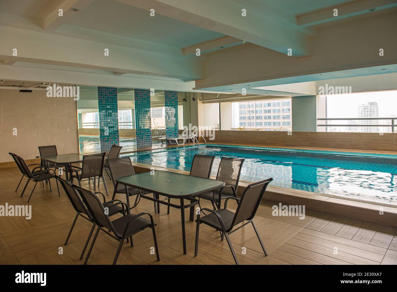 Empty swimming pool area at modern condominium building Stock Photo - Alamy