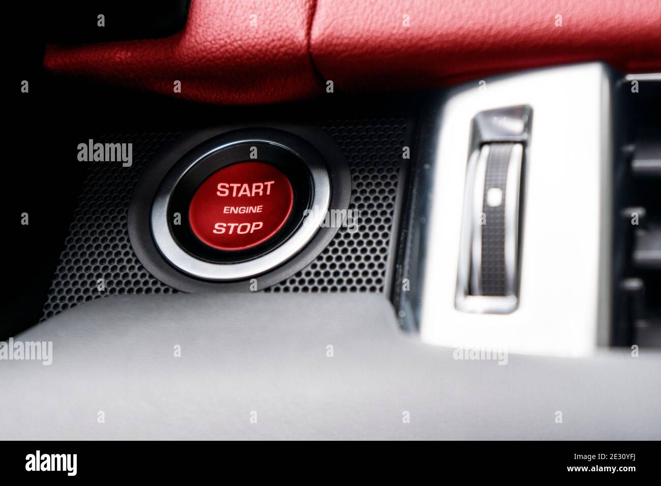Car dashboard with focus on red engine start stop button. Modern car ...