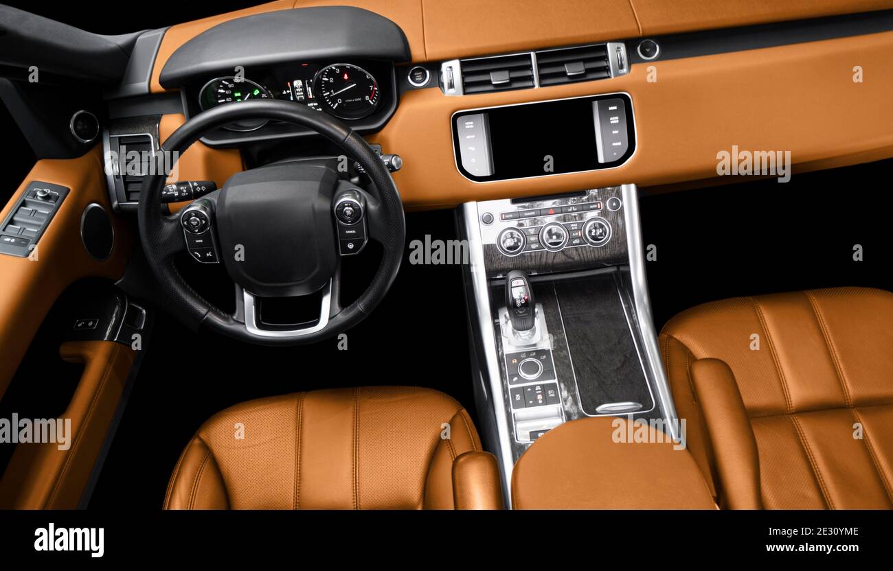 Brown luxury modern car Interior. Steering wheel, shift lever and ...