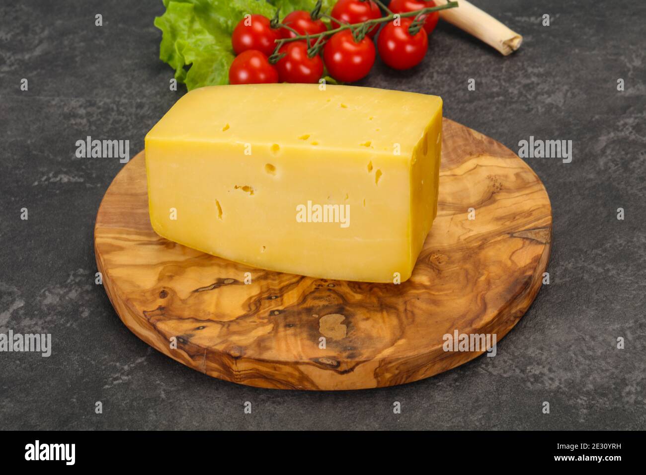 Swiss Hard yellow tasty cheese brick Stock Photo - Alamy