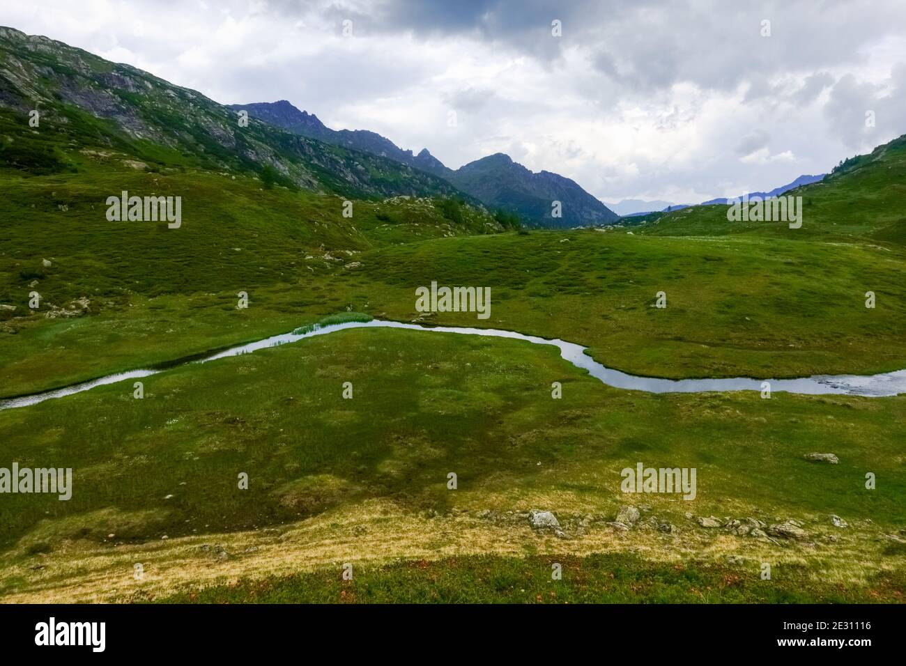 small calm brook in a green mountain landscape while hiking Stock Photo ...