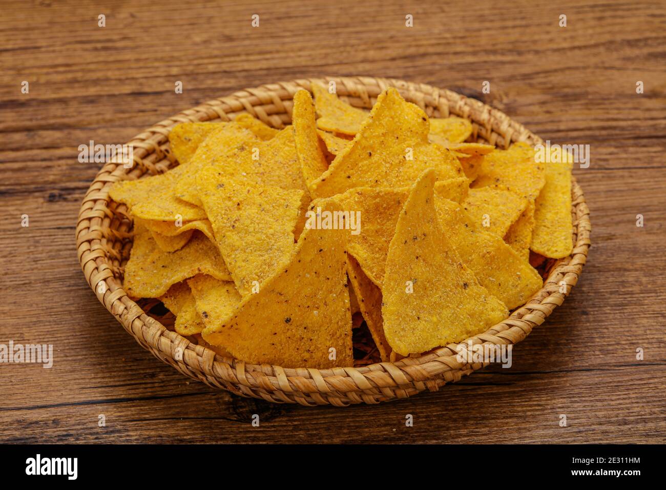 Mexican crunchy corn nachos triangle heap Stock Photo - Alamy
