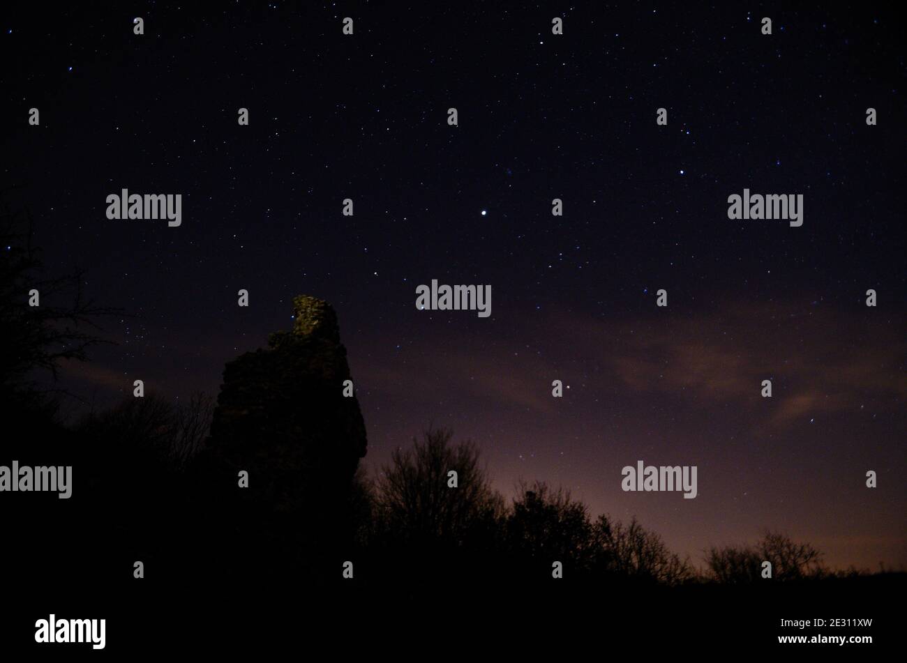 old ruin of stone and many stars at night Stock Photo - Alamy