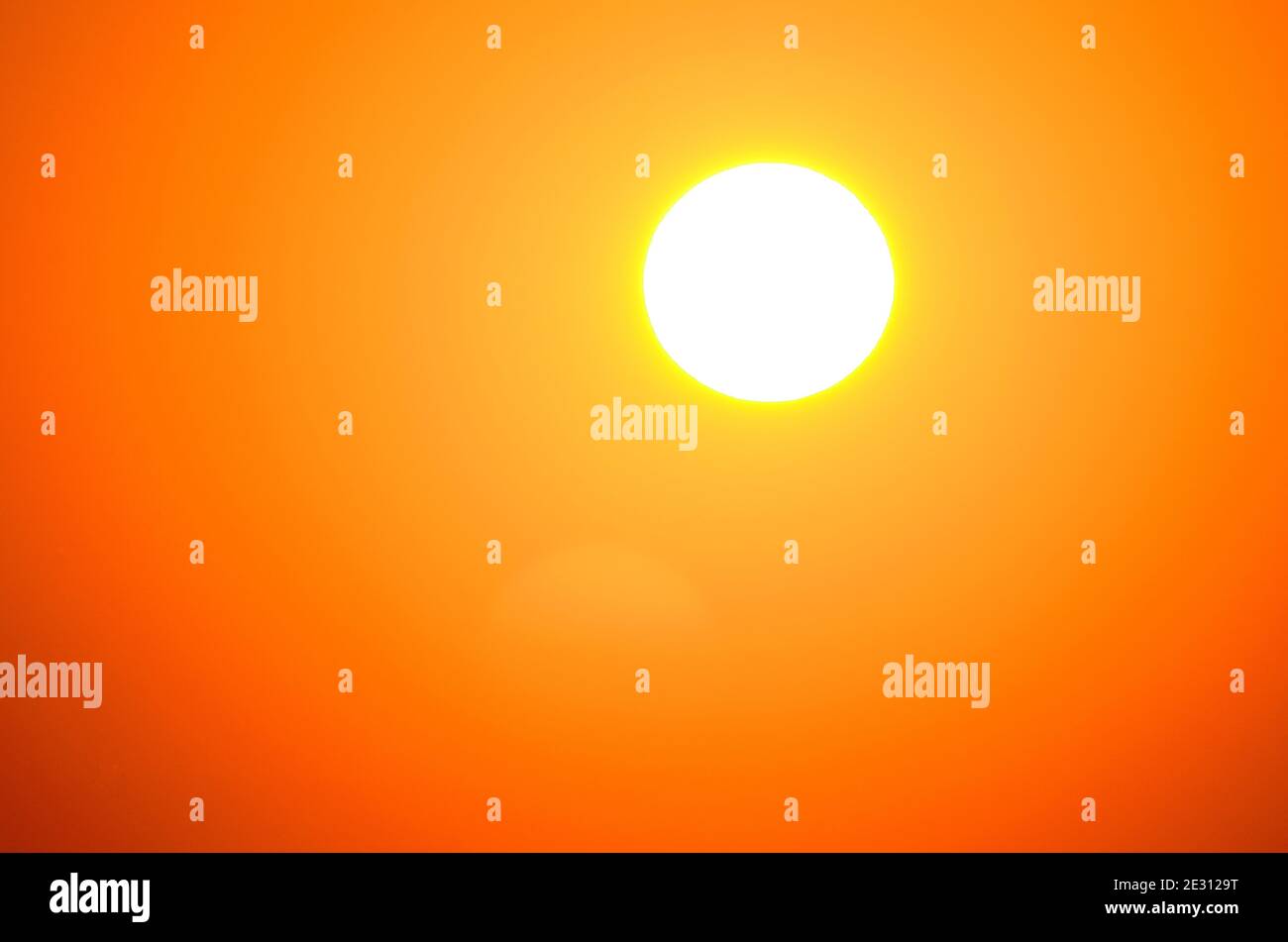 flash bright white sun and warm orange background Stock Photo - Alamy