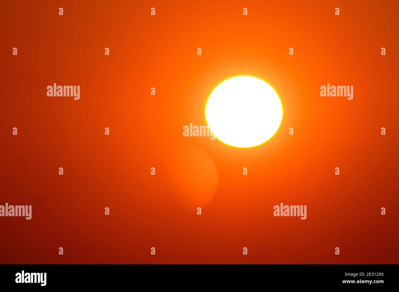 very nice bright white sun with orange background Stock Photo - Alamy