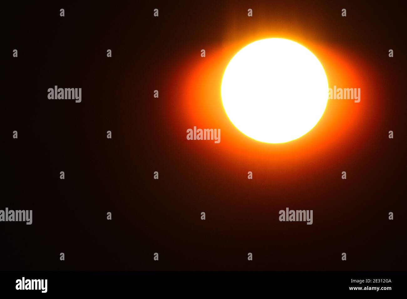 very brightly shining sun with radiation and dark sky closeup Stock ...