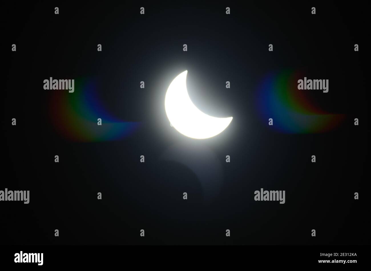 very bright shining solar eclipse with colorful reflection Stock Photo ...