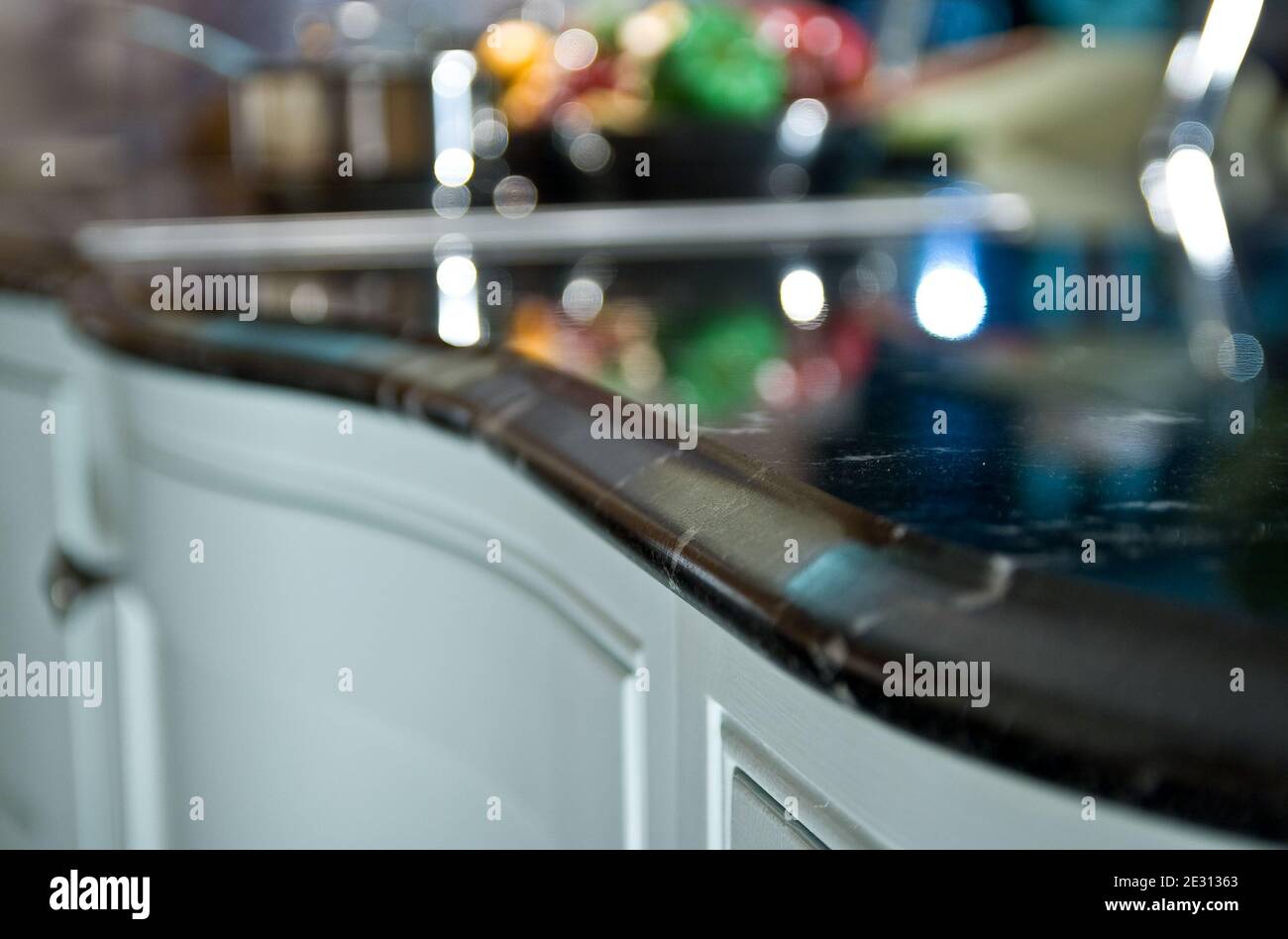 Perspective view of polished granite countertop, table top with bokeh ...
