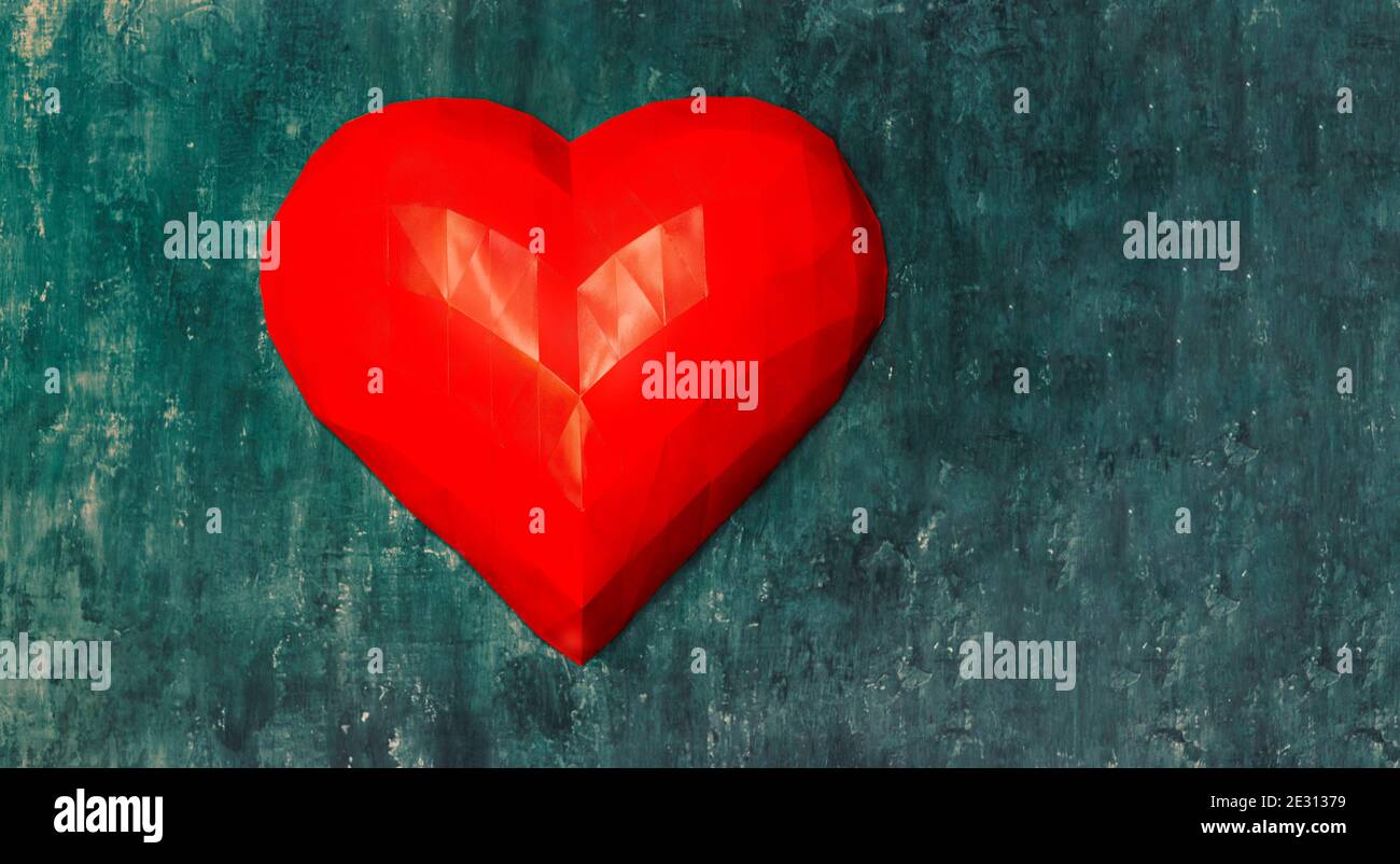 Large volumetric 3D red heart folded using the origami technique on a ...