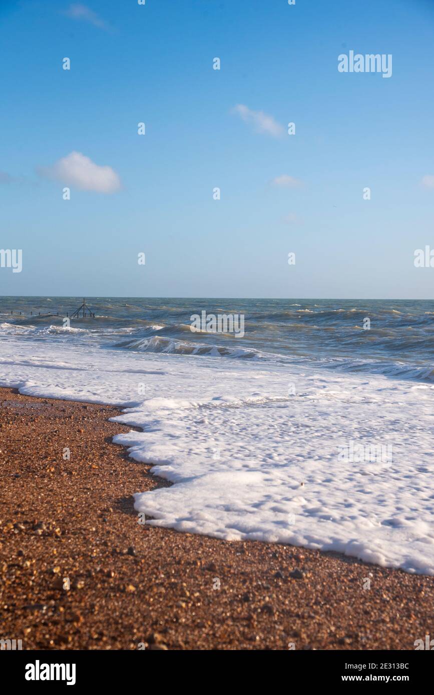 The tide on the beach in Hove on a sunny day, UK Stock Photo - Alamy