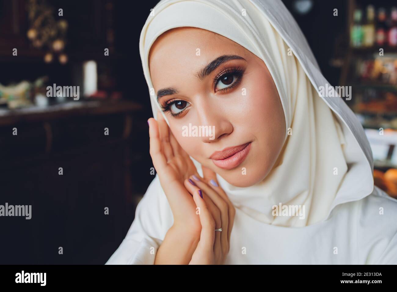 portrait of a beautiful Muslim woman in traditional Islamic clothing ...