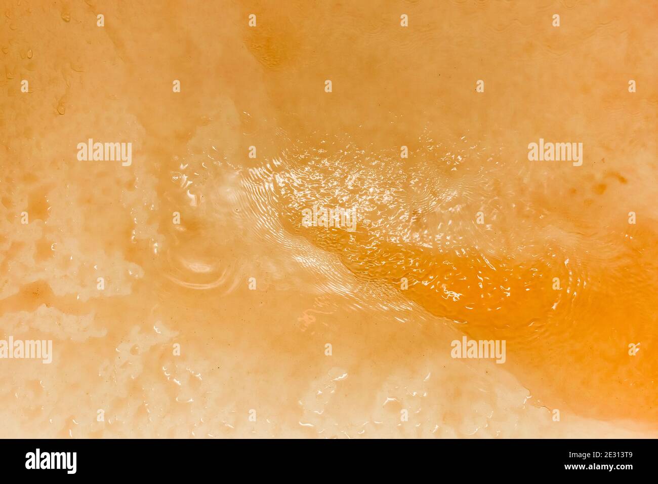 Dirty, rusty water on the surface of a sink or bath background Stock ...
