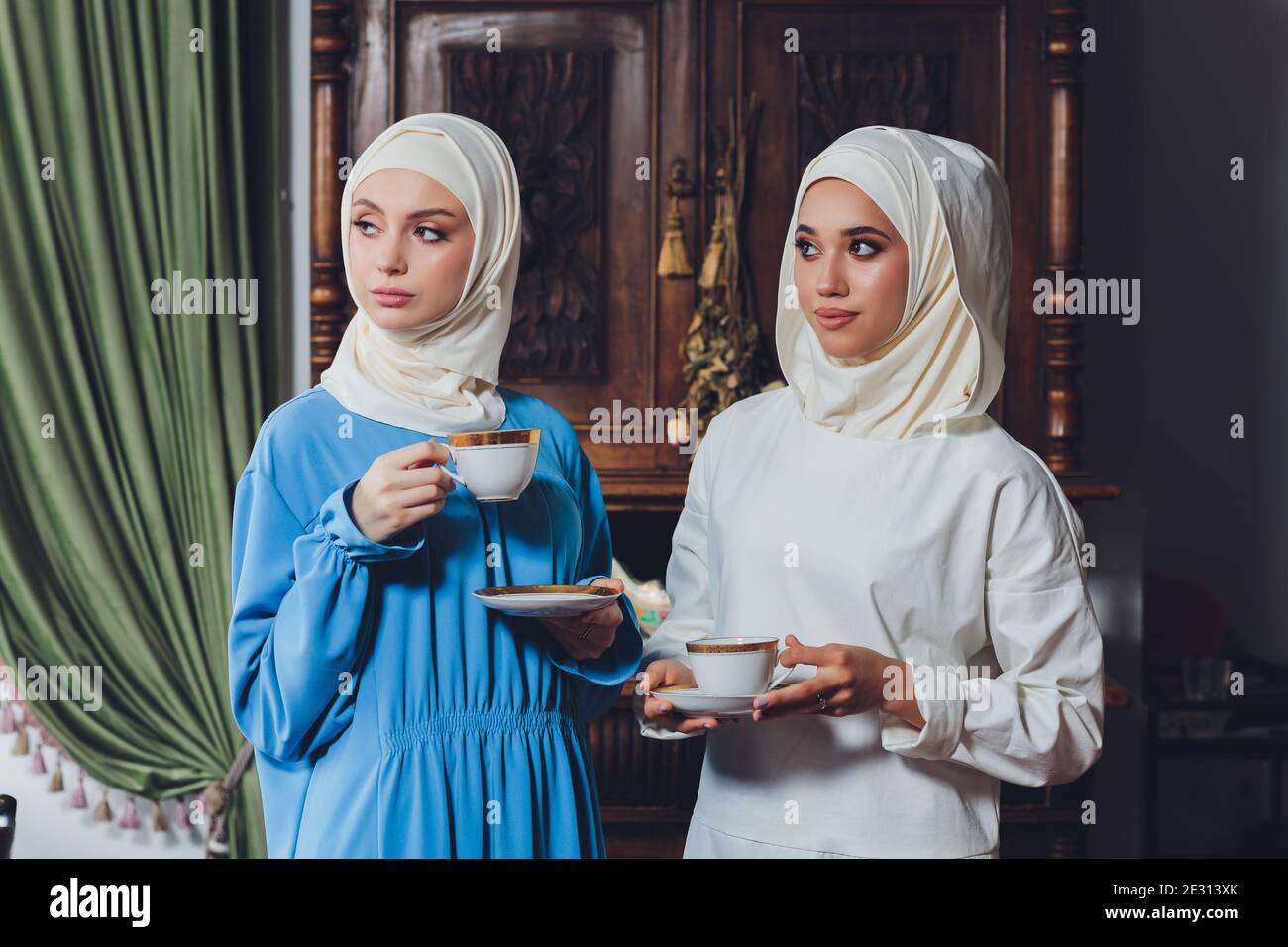muslim caucasian family drinking tea. Enjoying in tea time at home ...